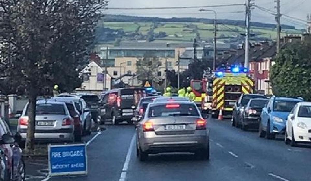 Emergency services called to scene of overturned car on busy road in ...